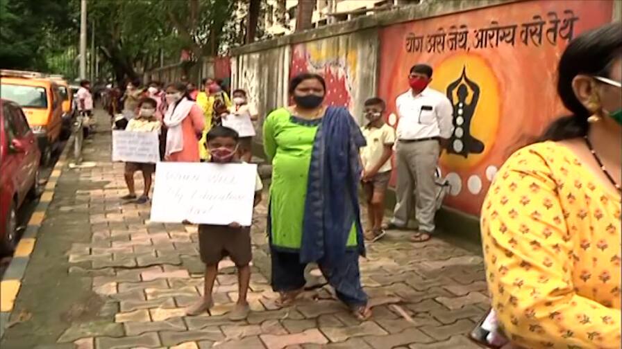Students and parents protest in front of IES New English School in ...
