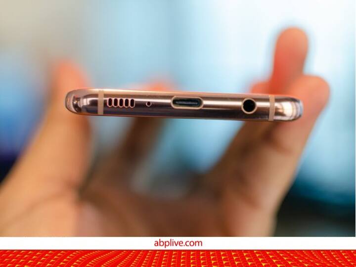 Mobile phone have 2 tiny holes under the smartphone know why they are ...