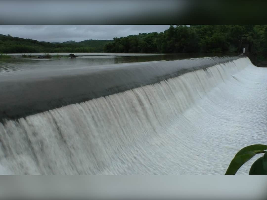 The Mandkhol Dam in Talkonkan is full to capacity and overflowing from ...