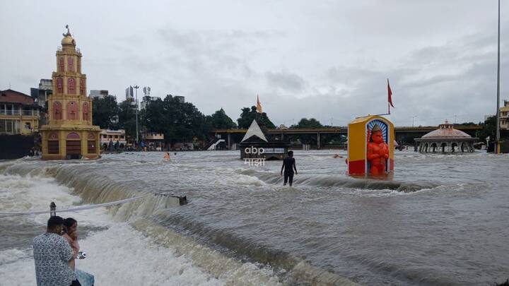 Nashik Rain Update Heavy rain in nashik Water discharge from Gangapur Dam See Photos | Nashik ...